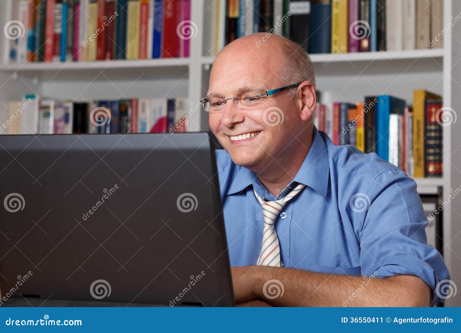 Laughing man with computer stock image. Image of message - 36550411