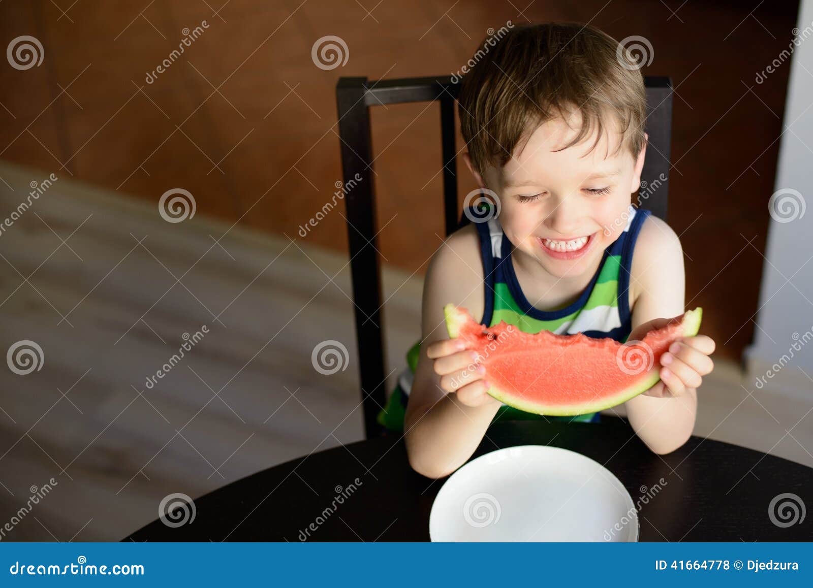 Laughing Preschooler Eats a Watermelon at the Table Stock Photo - Image ...