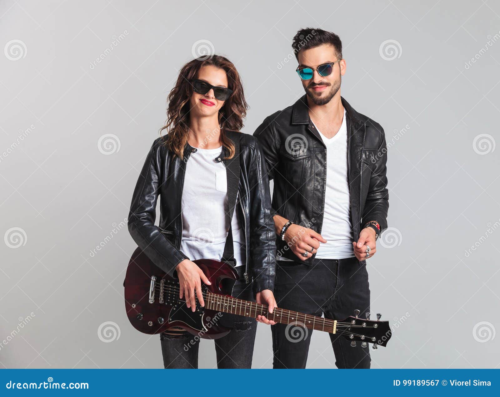 Laughing Rock and Roll Couple Stock Image - Image of hand, friend: 99189567