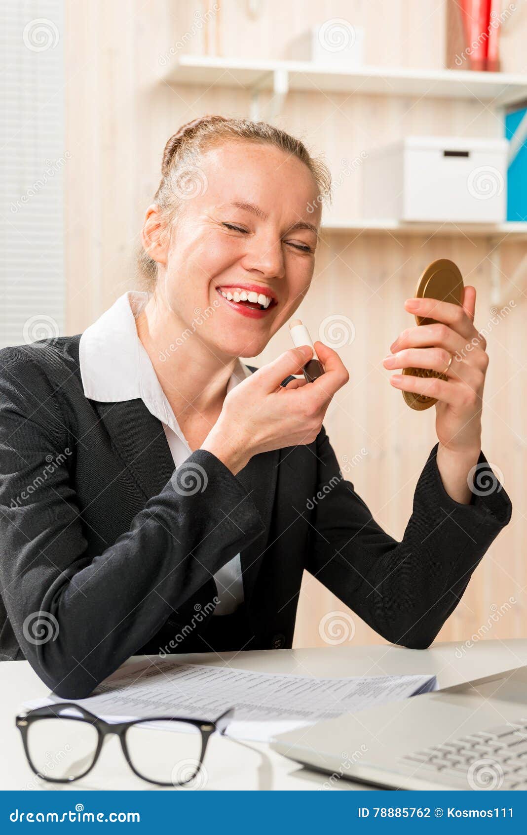 Laughing Secretary Corrects Make-up in the Workplace Stock Photo ...