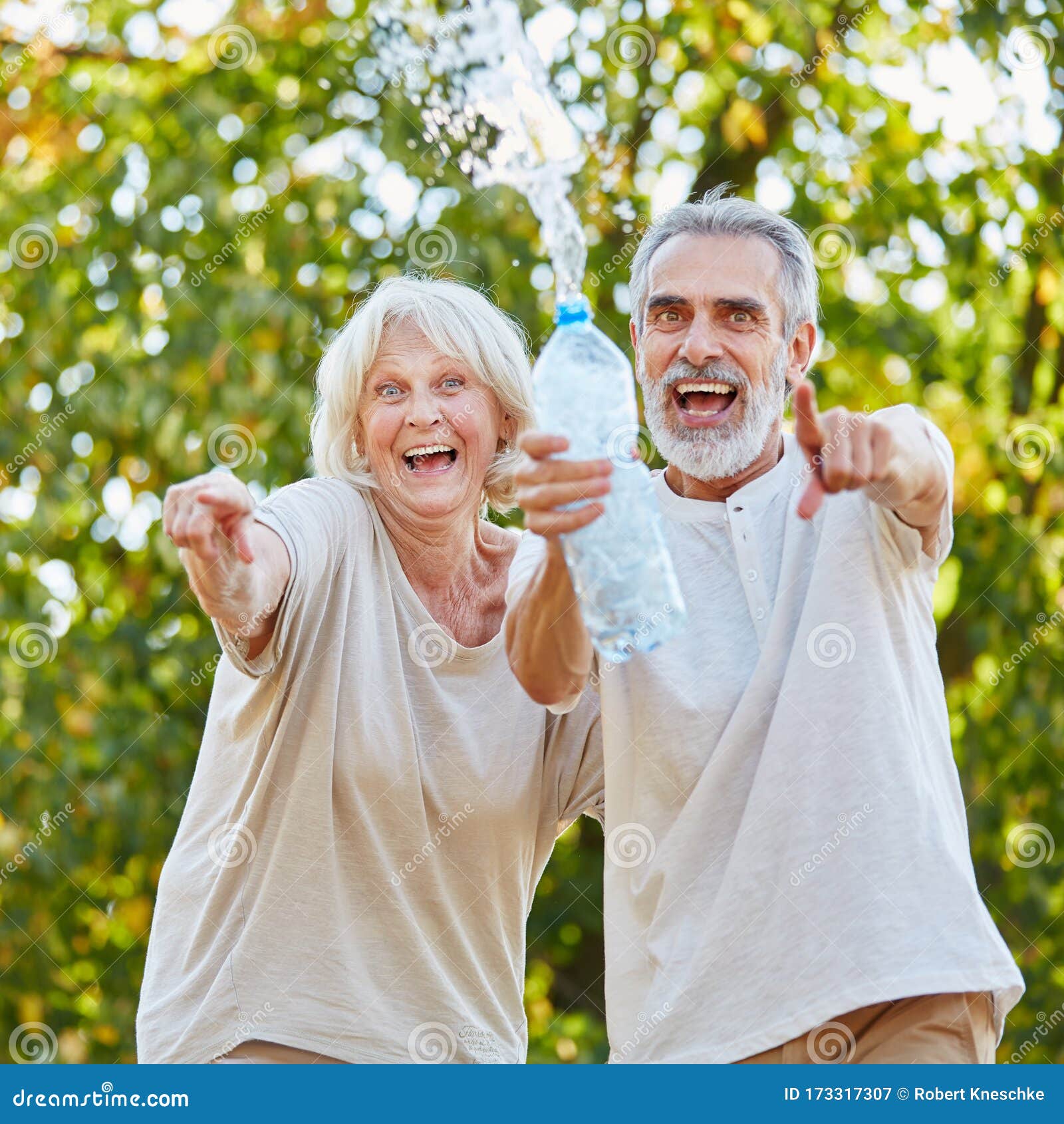 Laughing Seniors Splash with Water Stock Image - Image of laugh, bottle ...