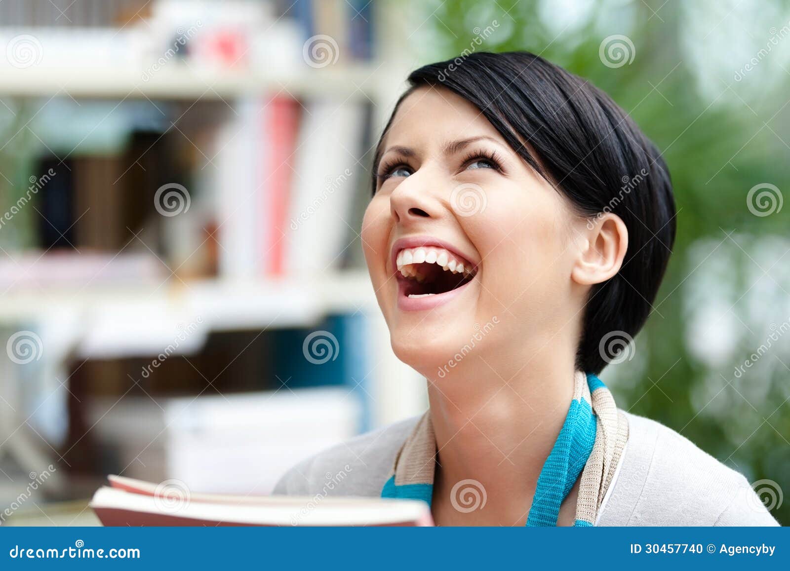 Laughing Student with Book at the Library Stock Photo - Image of data ...