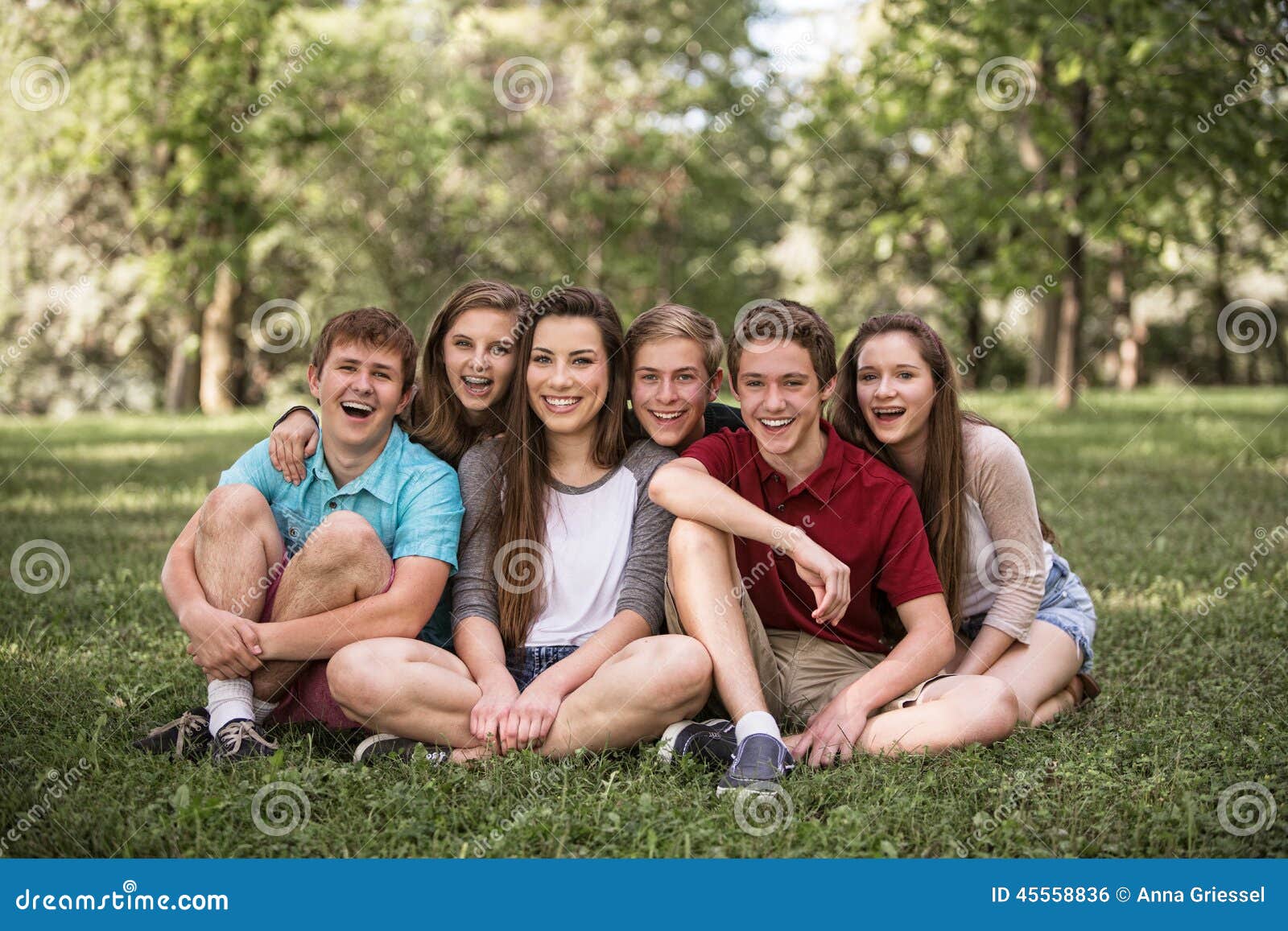 Laughing Teens Outdoors stock photo. Image of embracing - 45558836