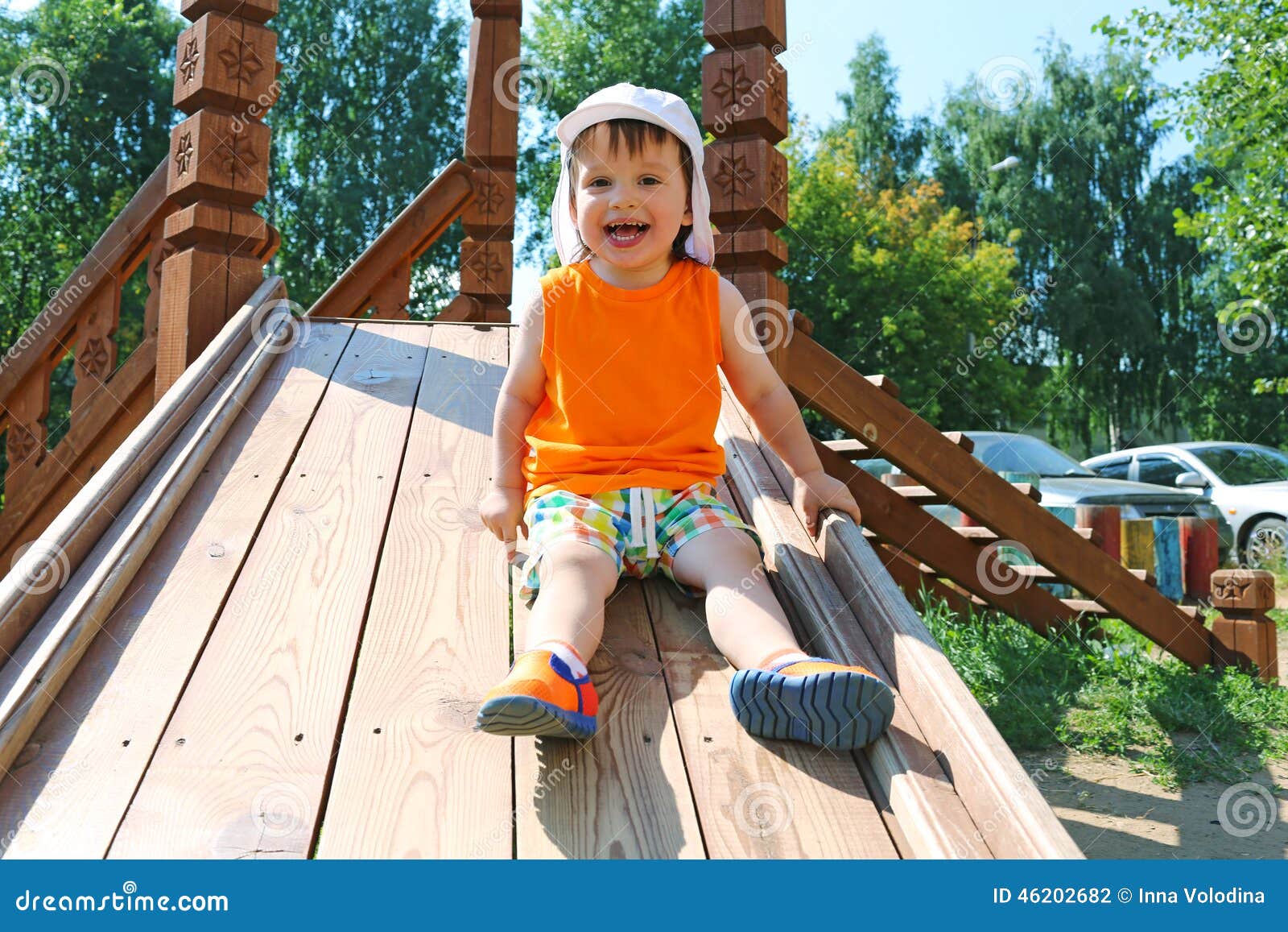 Laughing Toddler Boy Sliding on Playground Stock Photo - Image of ...