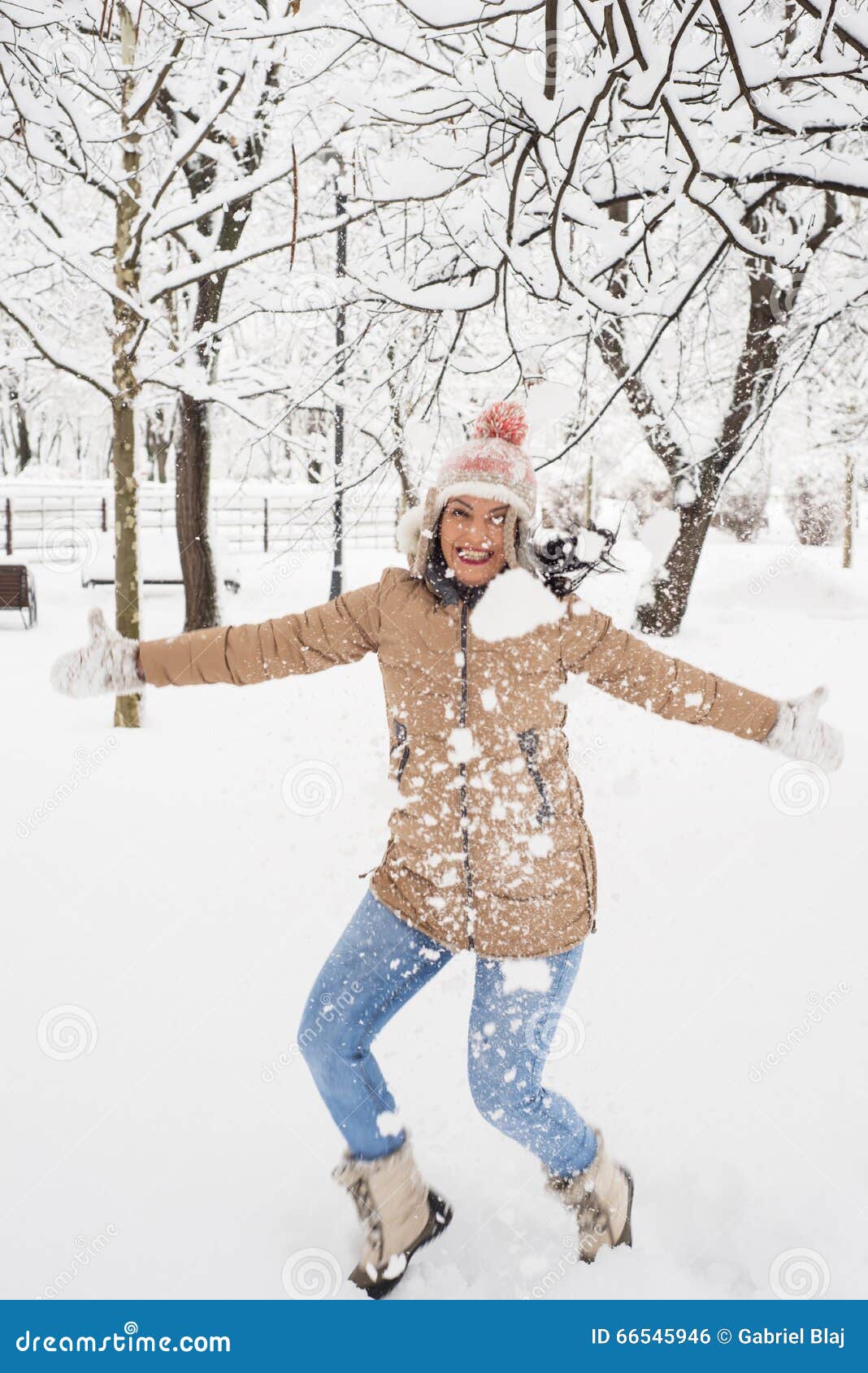 Laughing Woman Jumping in Snow Stock Photo - Image of frozen, caucasian ...