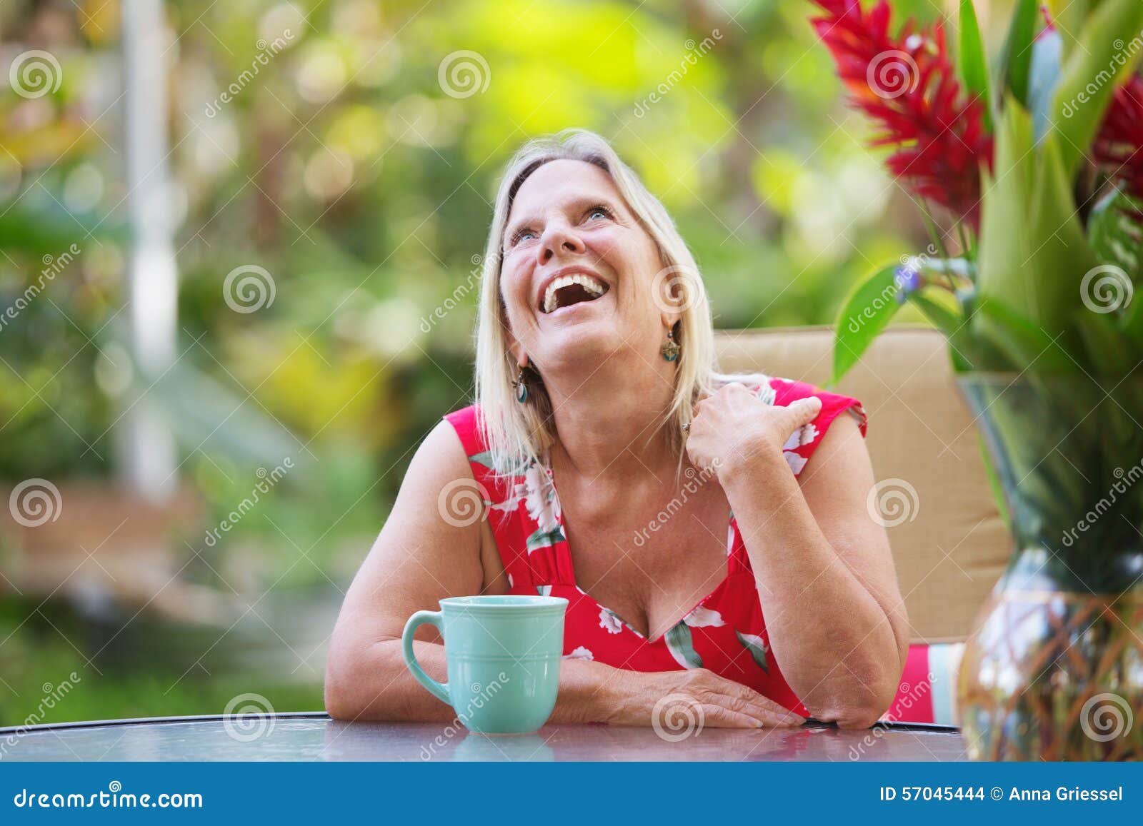 Laughing Woman Sitting at Table Stock Photo - Image of european, aged ...