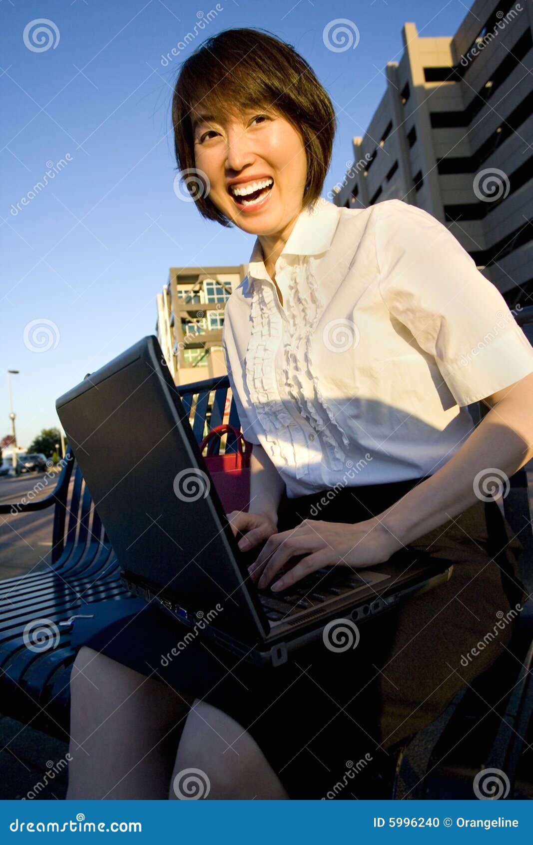 Laughing Woman Works on Laptop - Vertical Stock Photo - Image of laptop ...