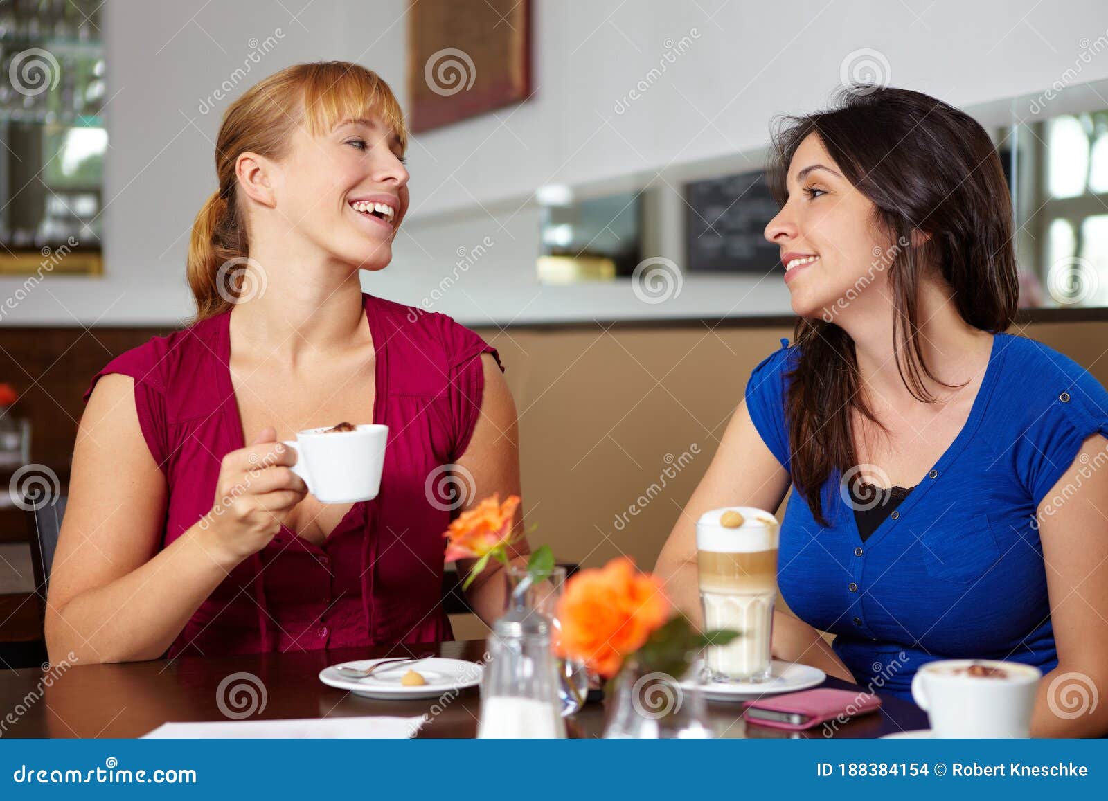 Laughing women in the cafe stock photo. Image of couple - 188384154