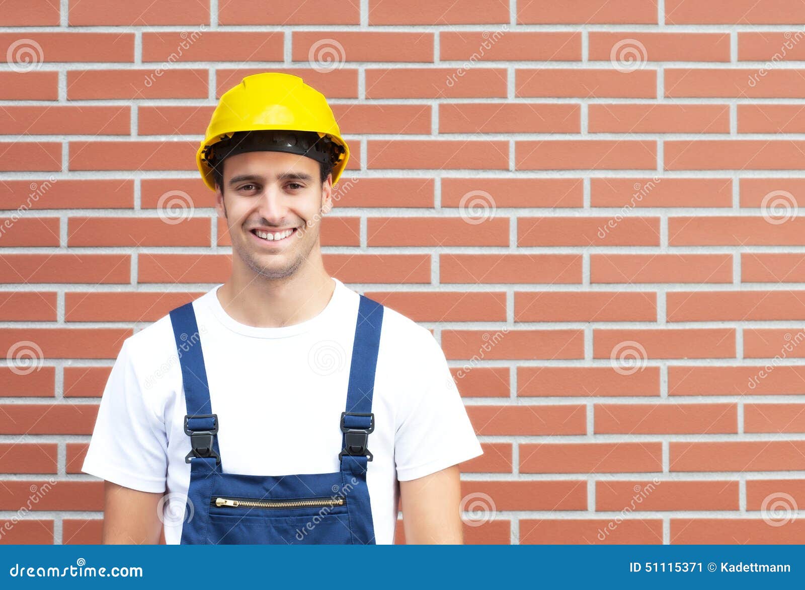 Laughing Worker in Front of a Brick Wall Stock Image - Image of ...