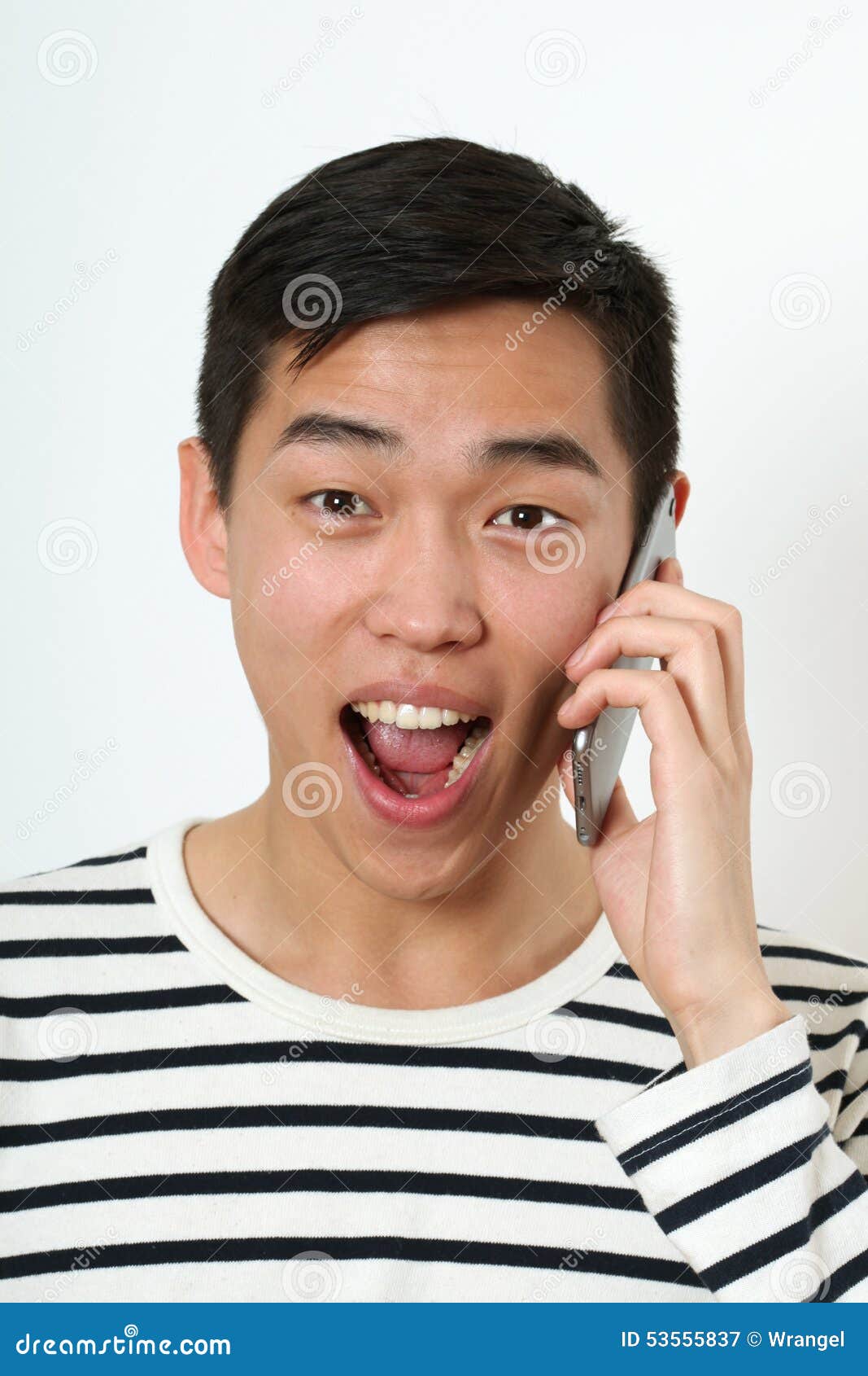 Laughing Young Asian Man Using a Smartphone Stock Image - Image of ...