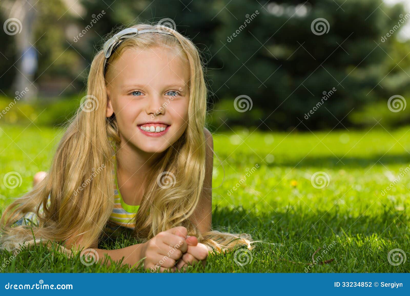 Laughing Young Girl on the Grass Stock Photo - Image of happiness ...