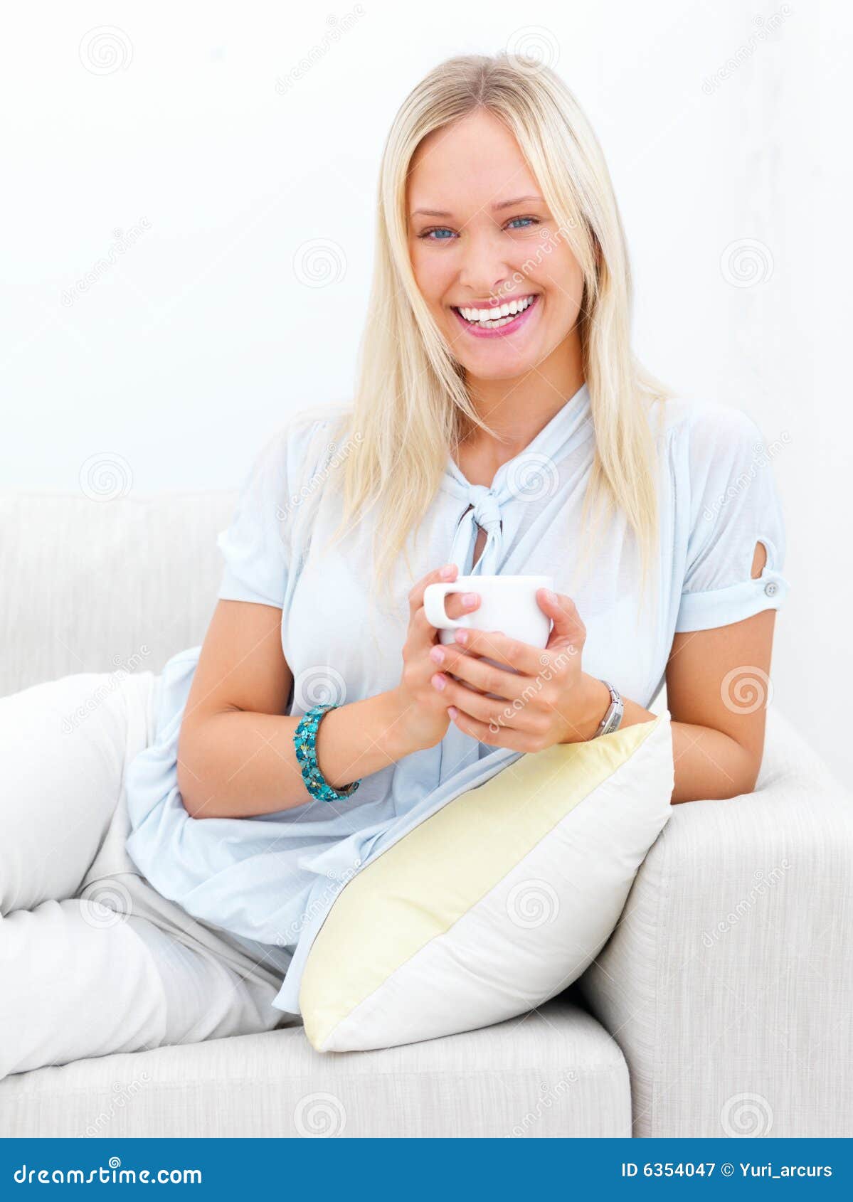 Laughing Young Lady Sitting on Sofa, Drinking Stock Image - Image of ...