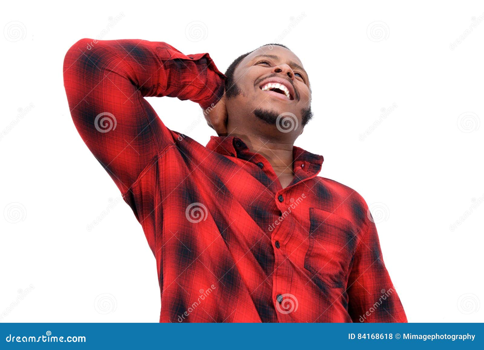 Laughing Young Man with Hand Behind Head Stock Photo - Image of face ...