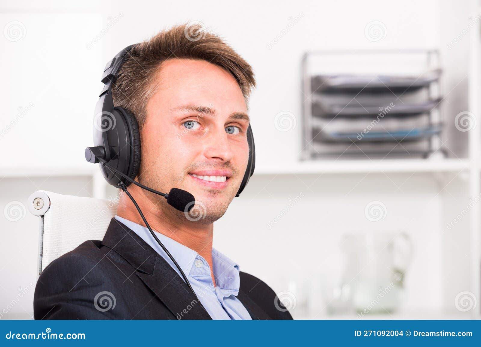 Laughing Young Man Talking on Headset at Office Stock Photo - Image of ...