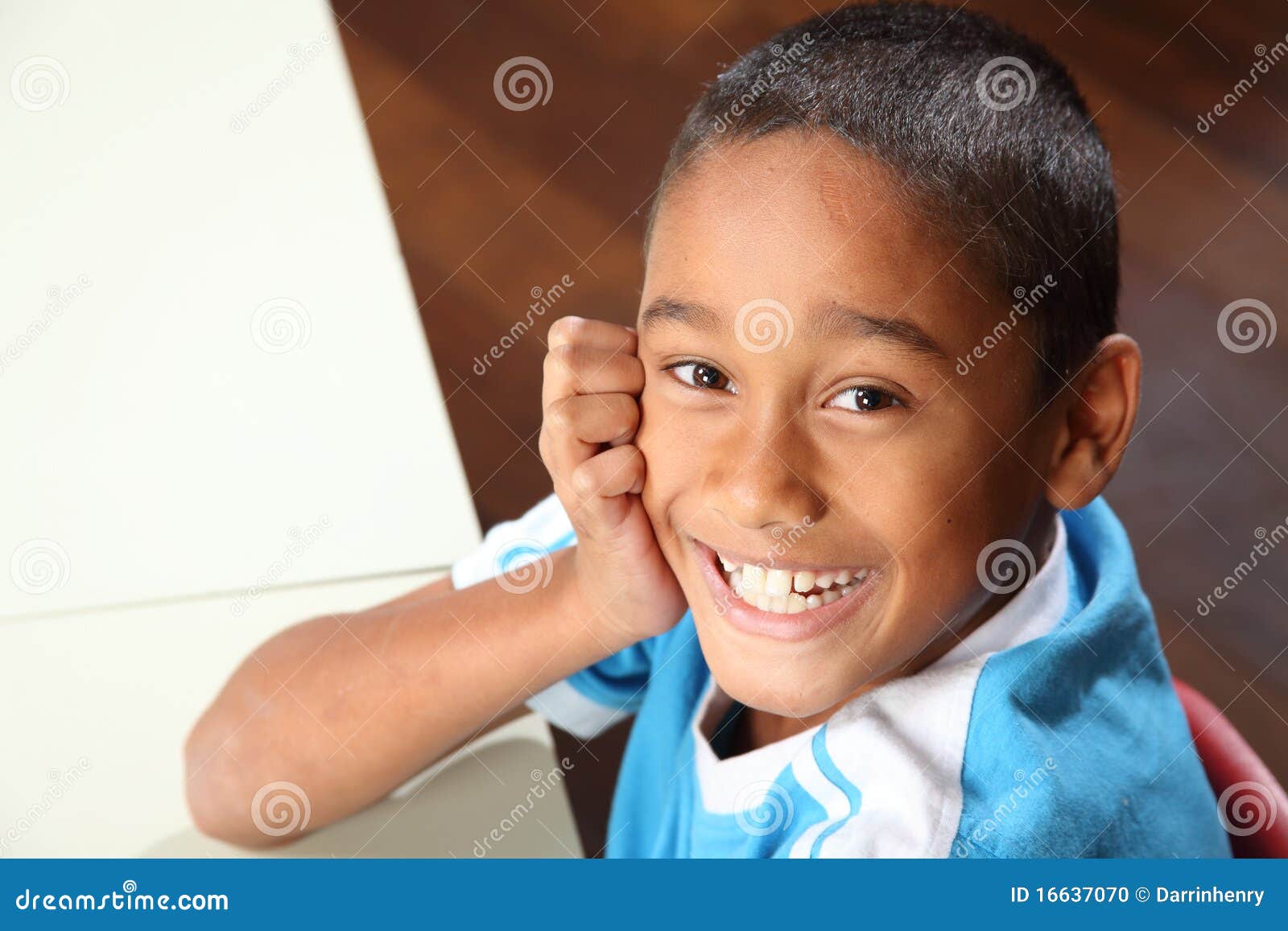 Laughing Young School Boy 9 Sitting To His Classroom Stock Photo ...