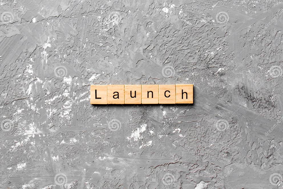 Launch Word Written on Wood Block. Launch Text on Table, Concept Stock ...