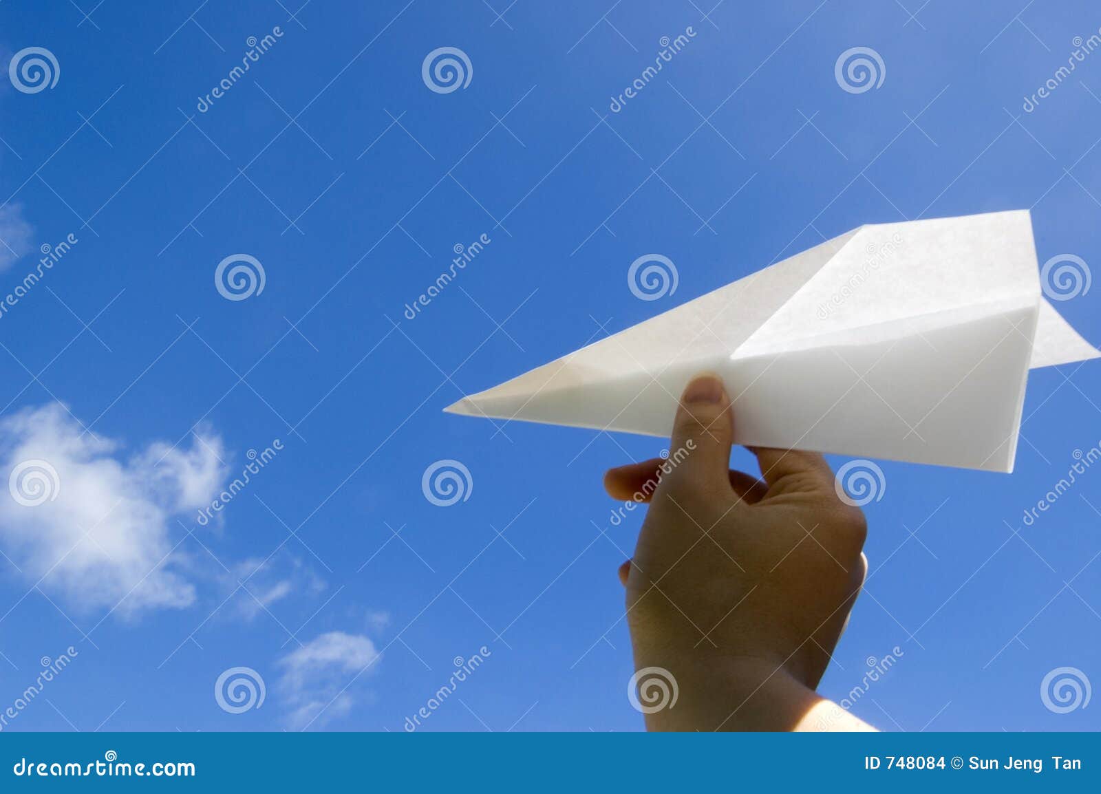 Launching a paper airplane stock photo. Image of sheet - 748084