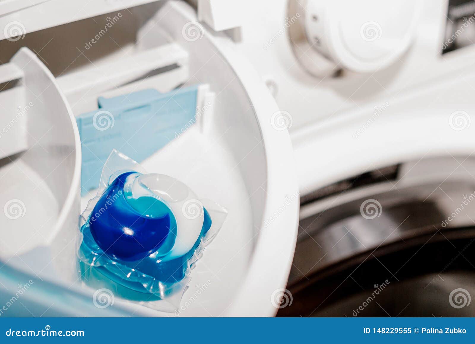 Laundry Blue Capsule in a Washing Machine Stock Image - Image of ...