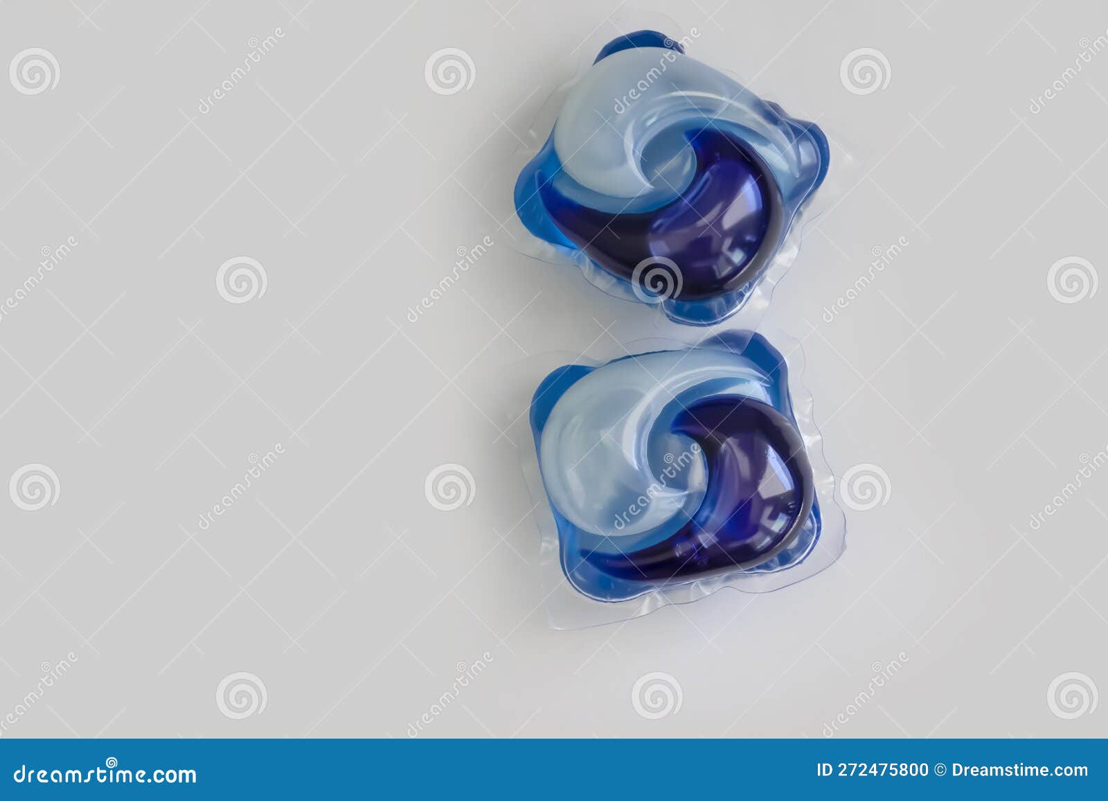 Laundry Capsules And Kitchen Towel On A White Marble Background ...