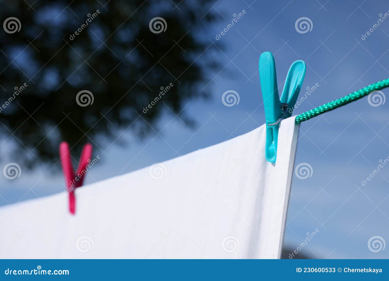 Laundry with Clothes Pins on Line Outdoors, Closeup Stock Image - Image ...