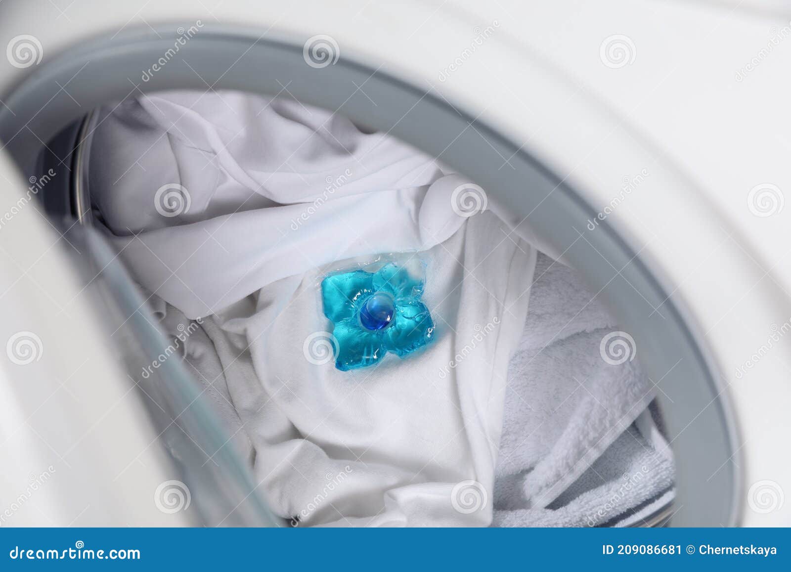 Laundry Detergent Capsule in Washing Machine Drum, Closeup View Stock ...