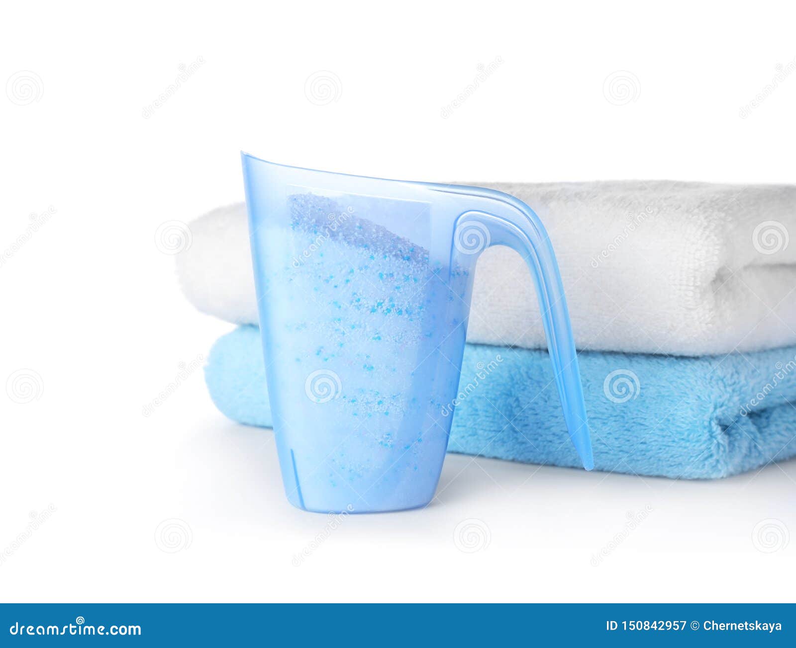 Laundry Detergent in Plastic Measuring Cup and Towels Stock Image ...
