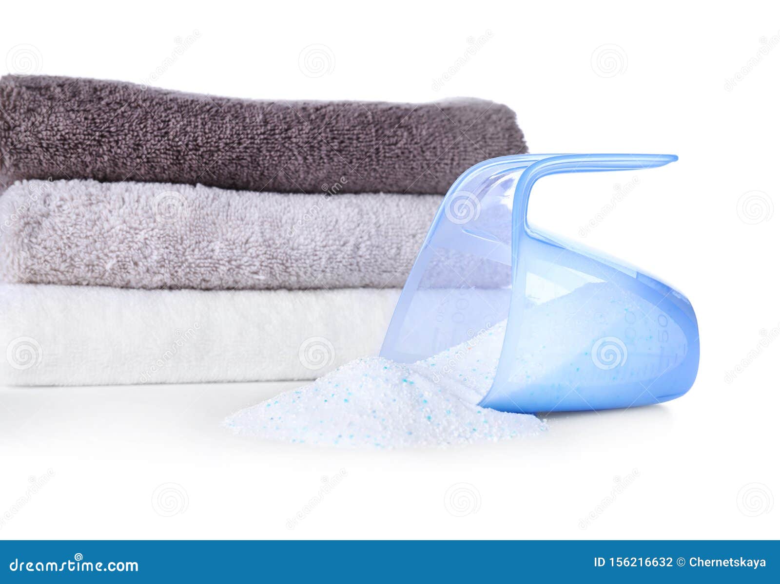 Laundry Detergent in Plastic Measuring Cup and Towels Stock Photo ...