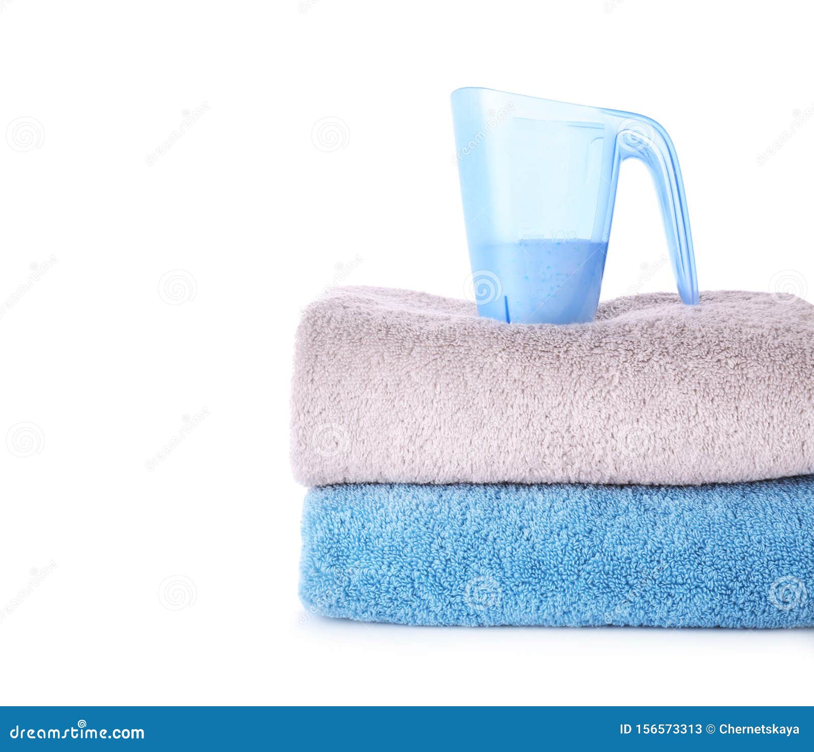 Laundry Detergent in Plastic Measuring Cup and Towels on White Stock ...