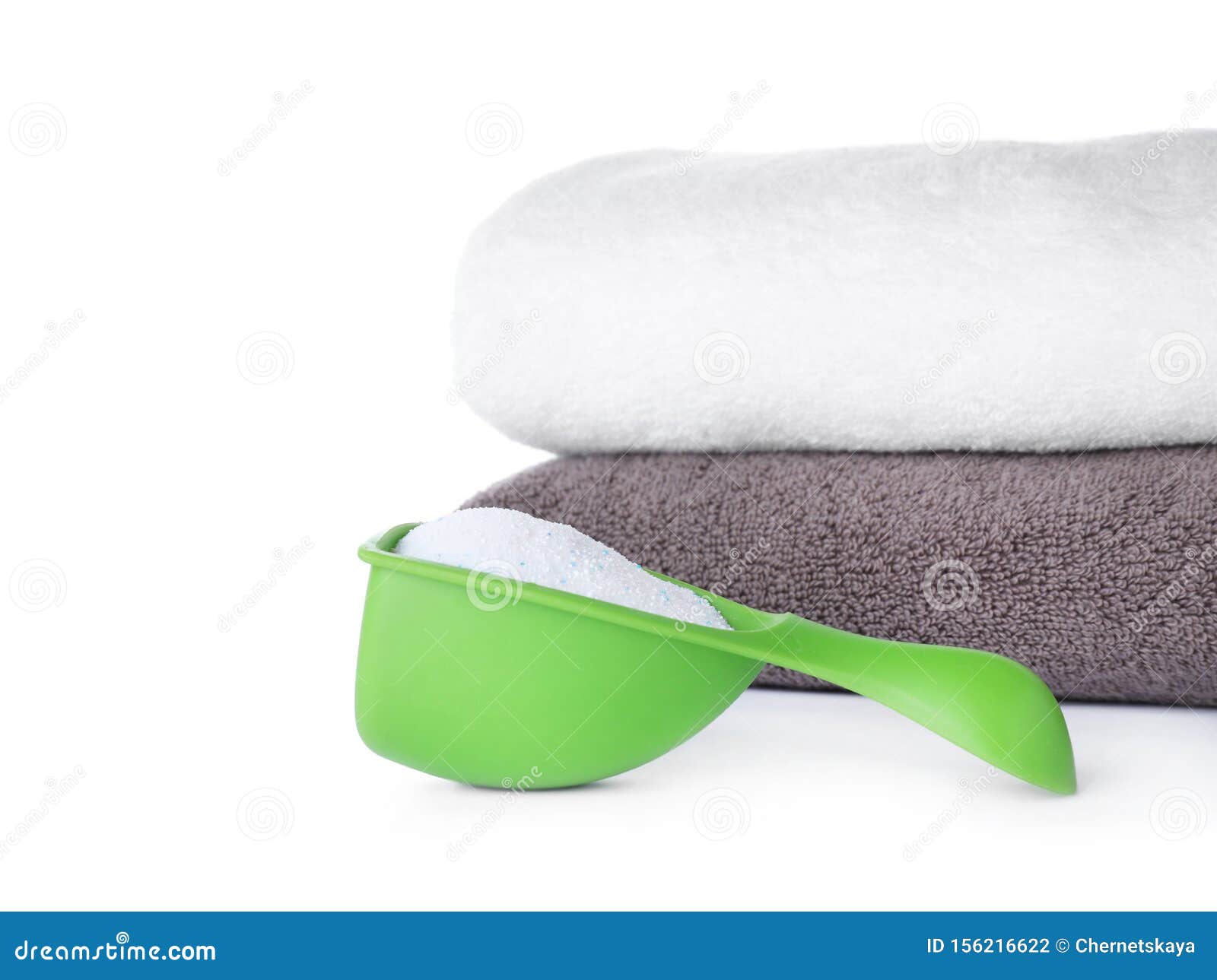 Laundry Detergent in Plastic Measuring Scoop and Towels on White Stock ...
