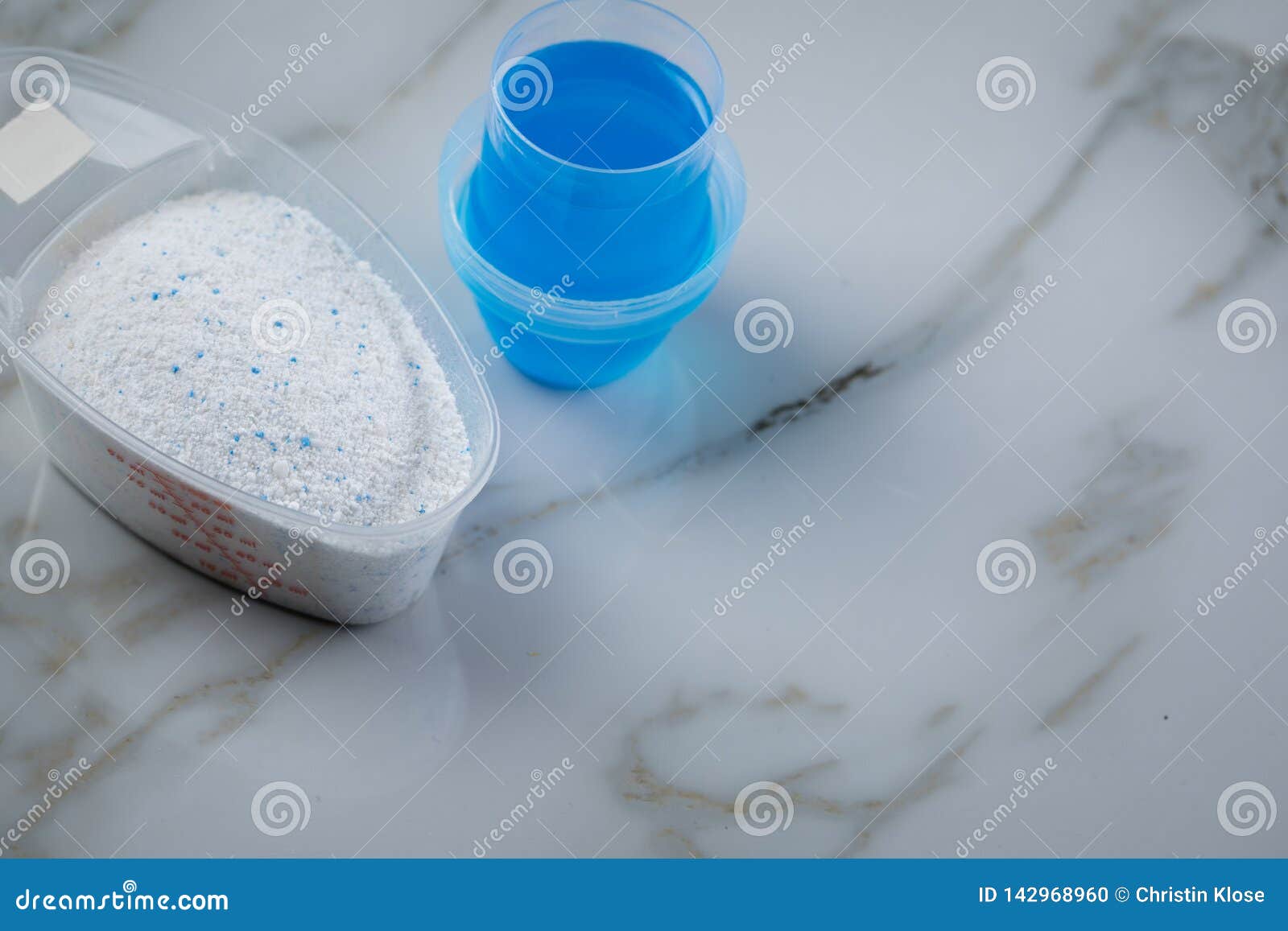 Laundry Detergent Powder and Blue Liquid Gel in Measuring Cup Stock ...