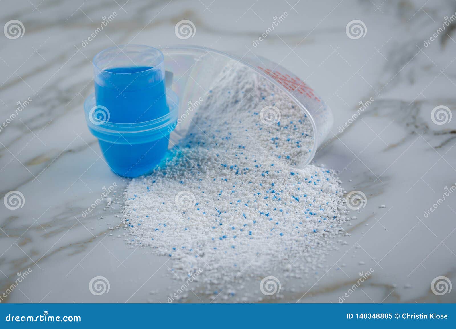 Laundry Detergent Powder and Blue Liquid Gel in Measuring Cup Stock ...