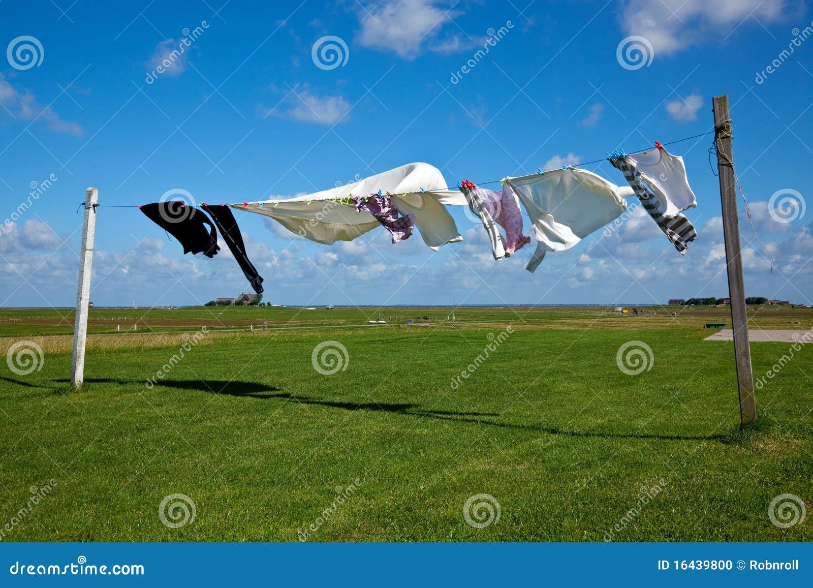 Laundry Drying on Clothes Line Against a Blue Sky Stock Photo - Image ...