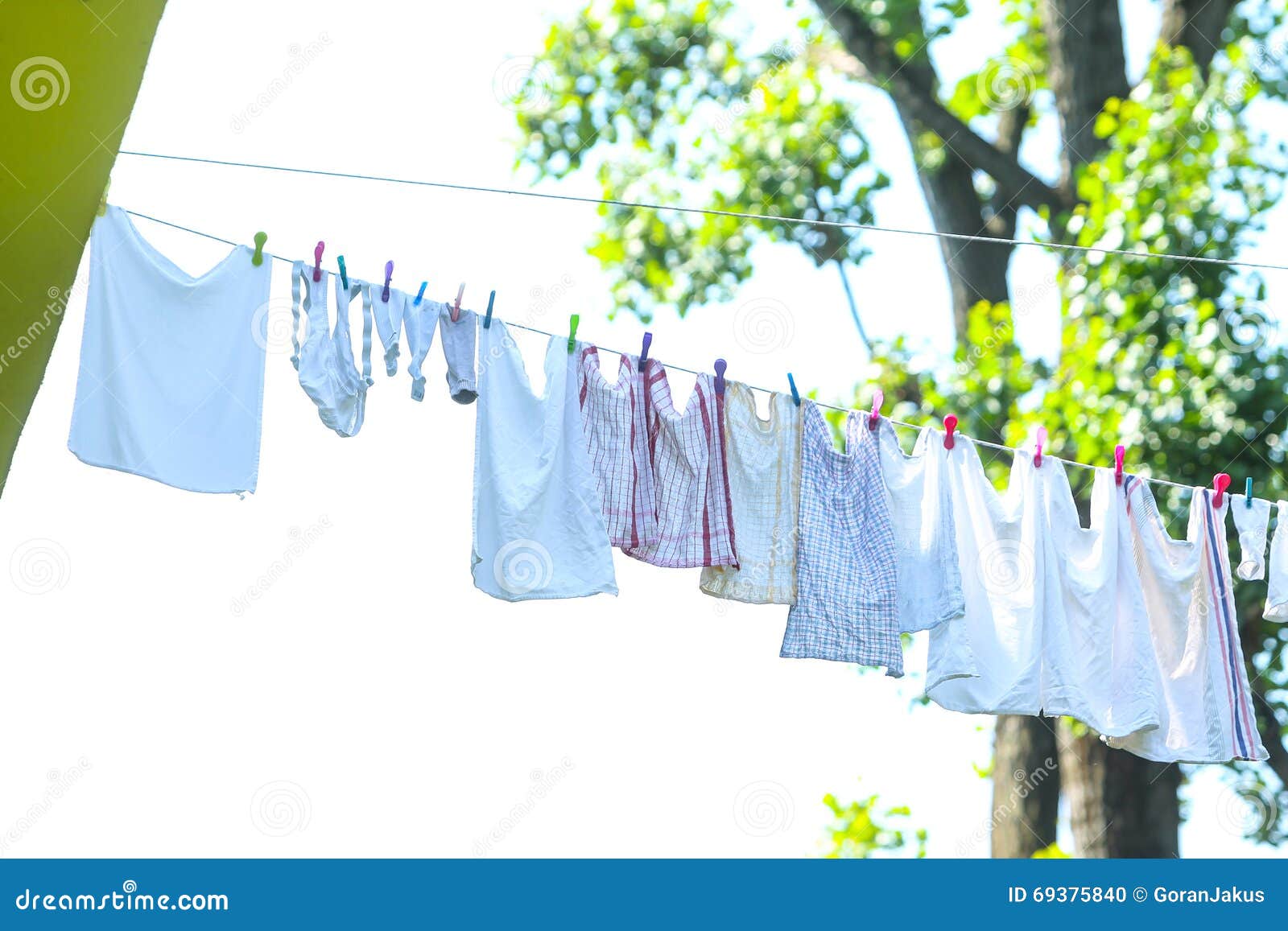 Laundry Hanging on Washing Line Stock Photo - Image of outside, clean ...