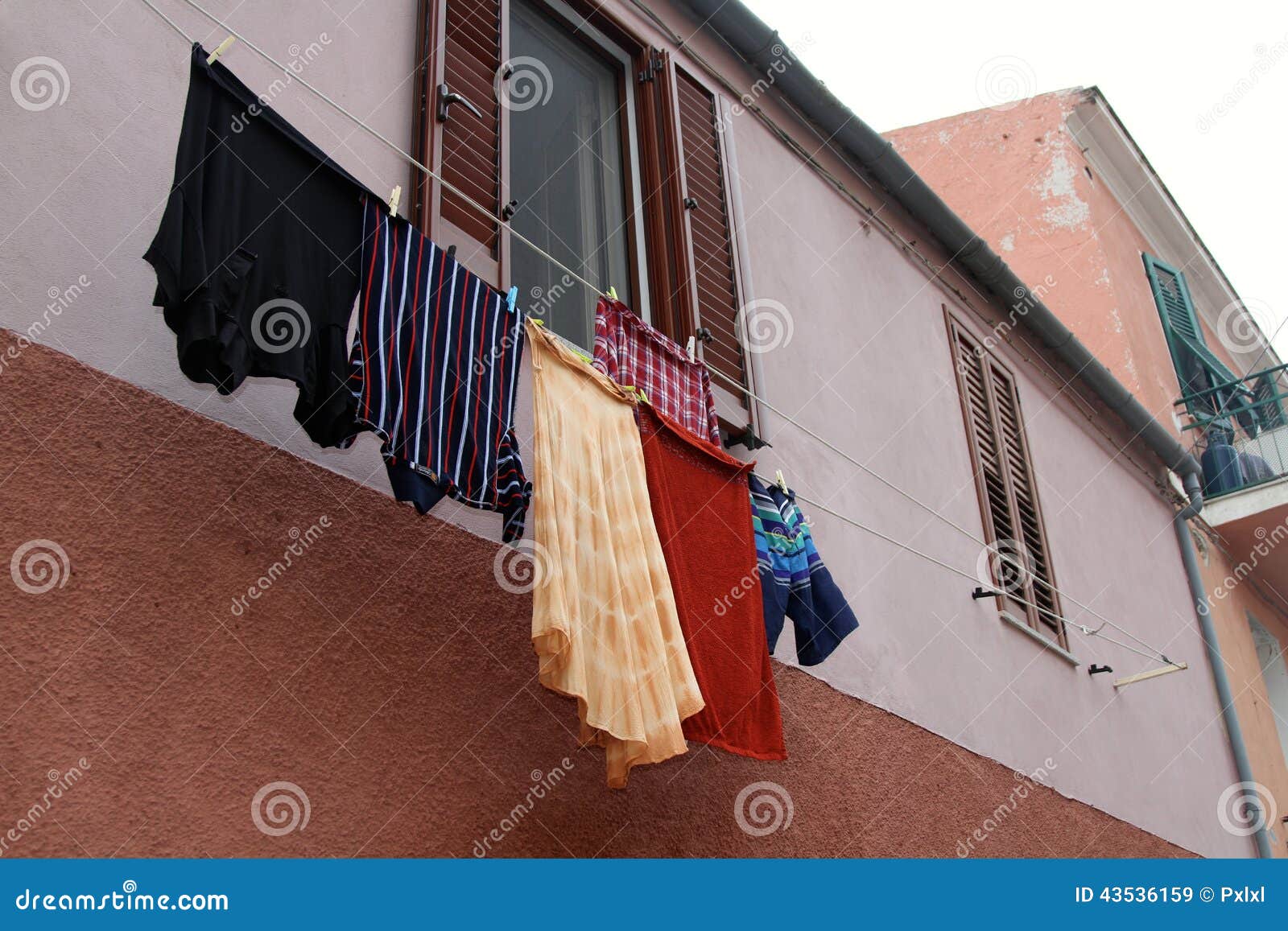 Laundry Hanging from a Window Stock Image - Image of venetian, typical ...