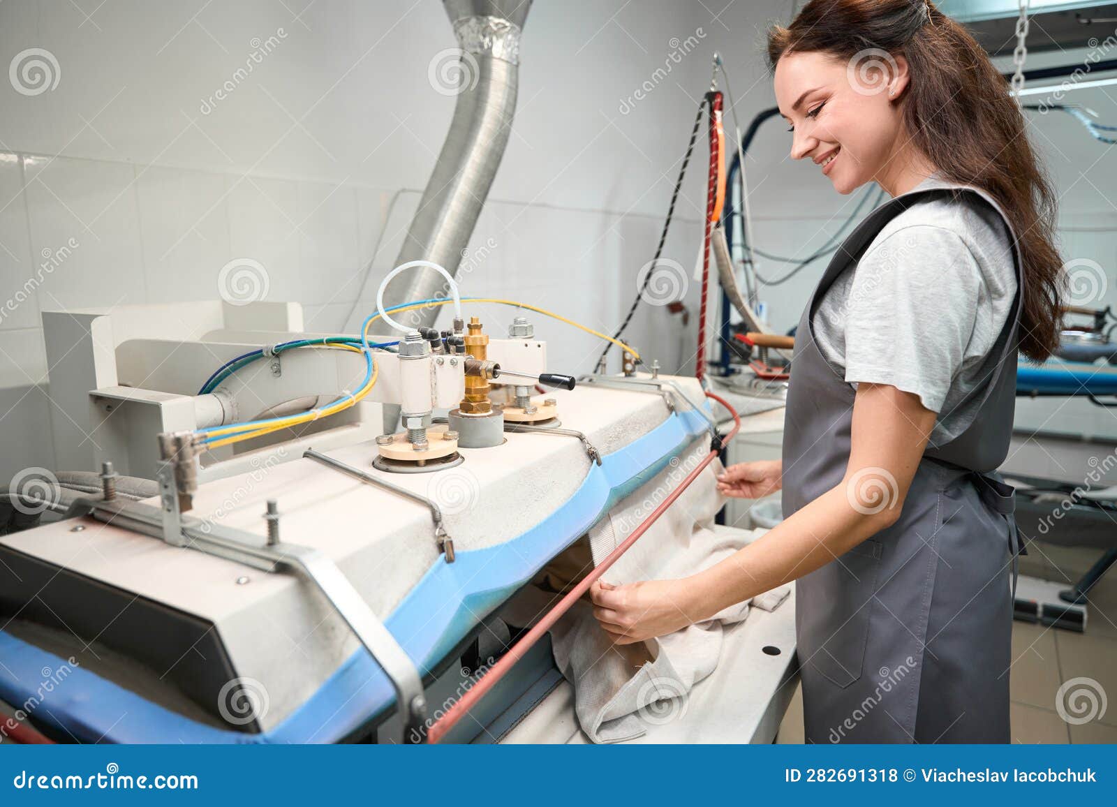 Laundry Service Worker Using Steam Press for Shaped-fixing and Ironing ...