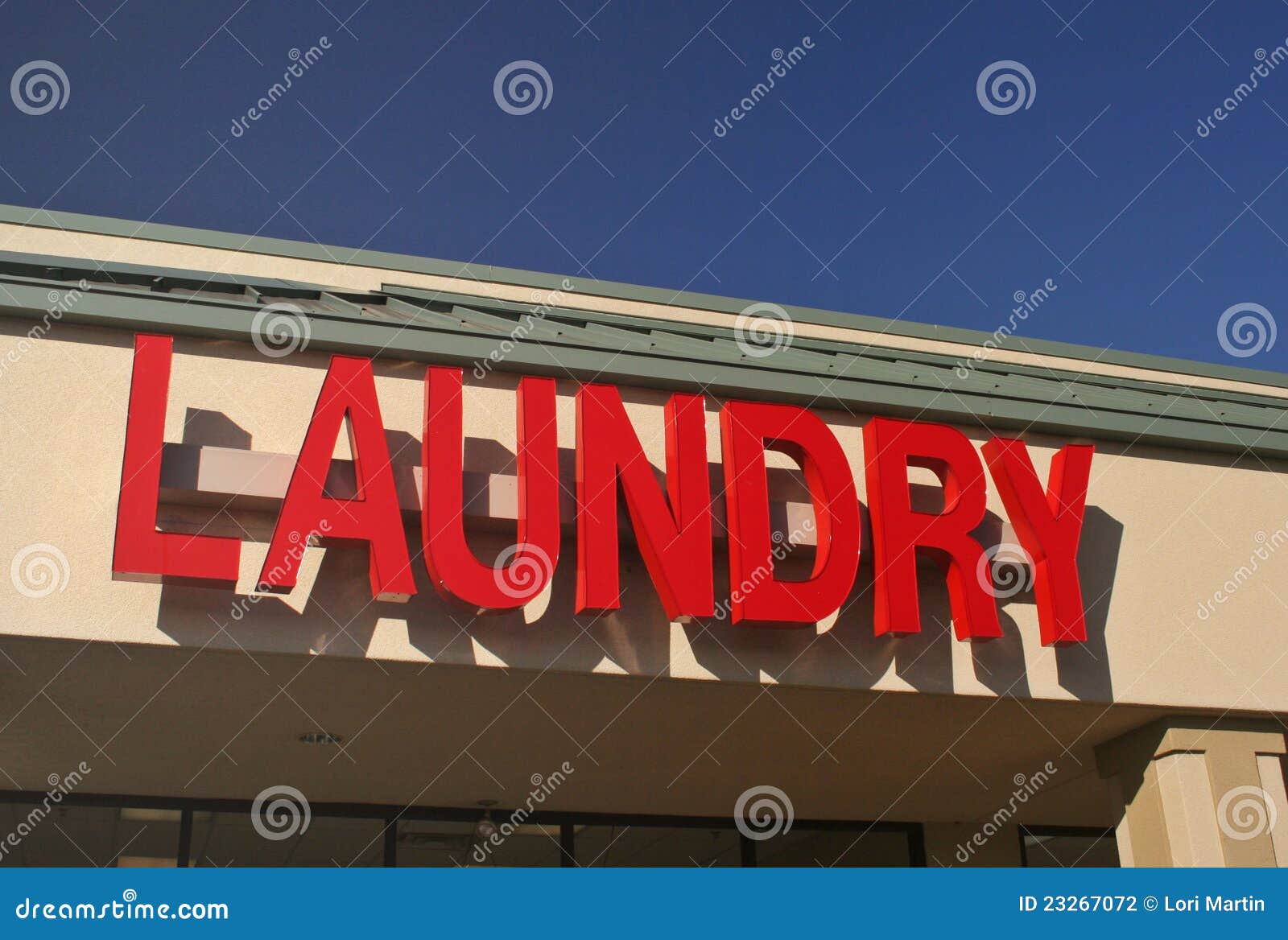 Laundry Sign on Building with Sky Stock Photo - Image of signage ...