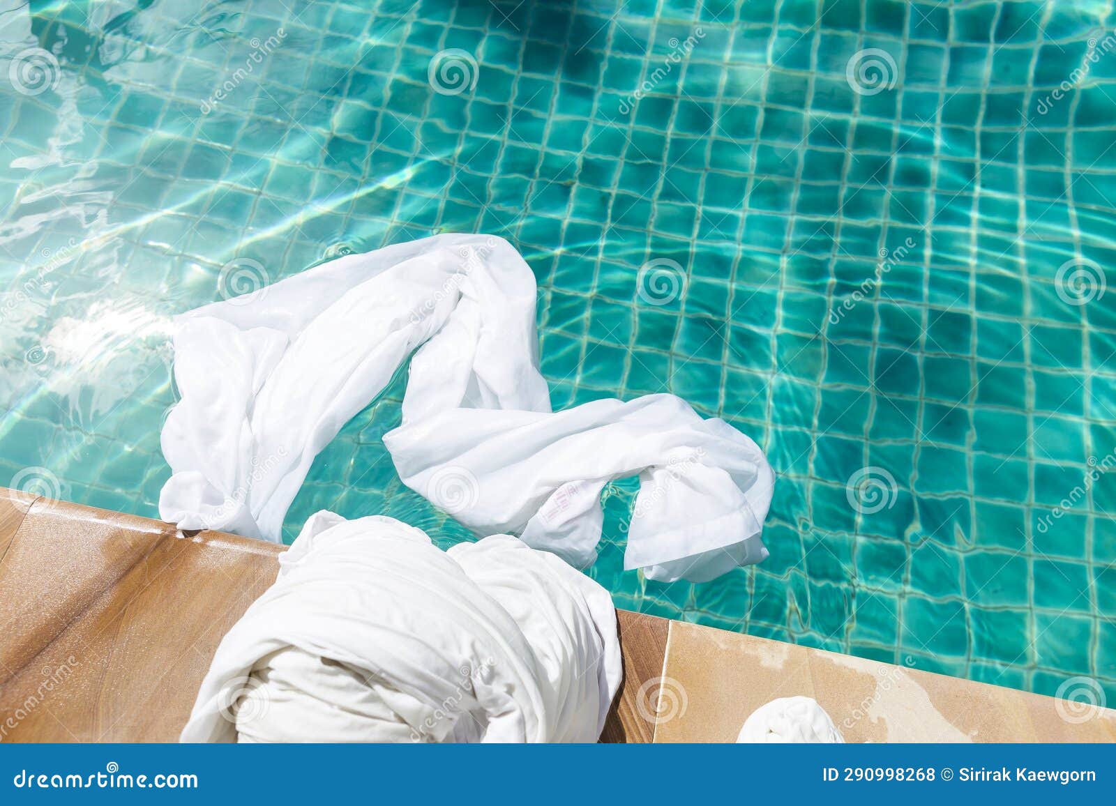 Laundry in swimming pool stock photo. Image of cloth - 290998268