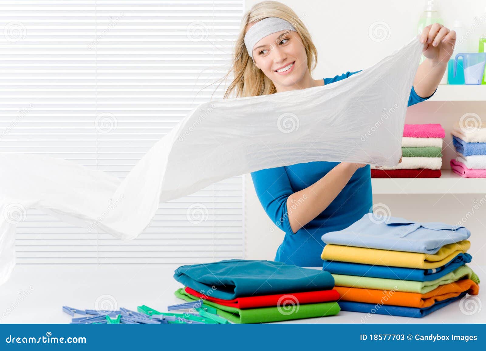 Laundry - Woman Folding Clothes Stock Image - Image of pile, clothespin ...