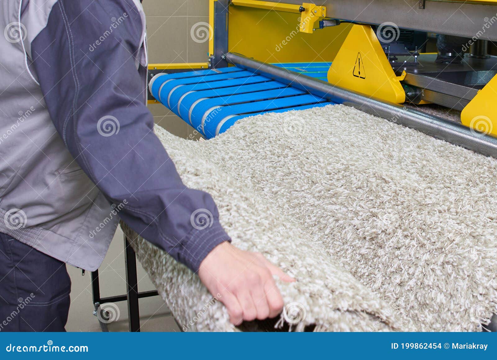 Laundry Worker in Process of Working on Automatic Machine for Carpet ...