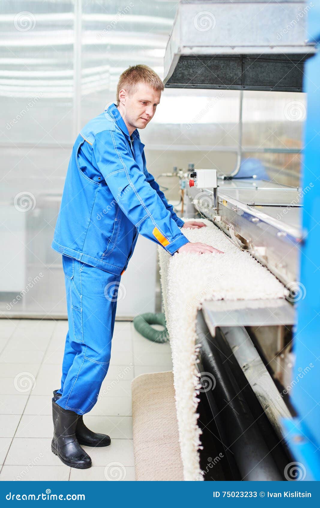 Laundry Worker in the Process of Working on the Automatic Machine for ...