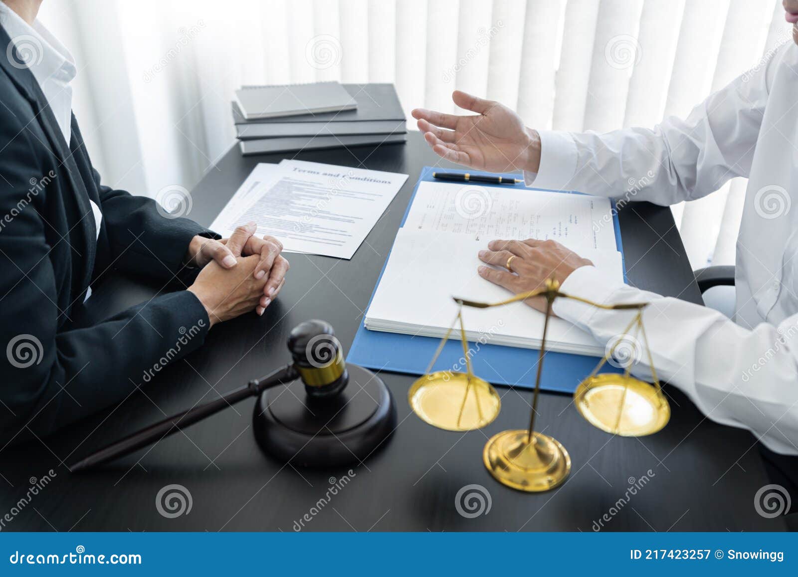 Law,libra Scale and Hammer on the Table, 2 Lawyers are Discussing about ...