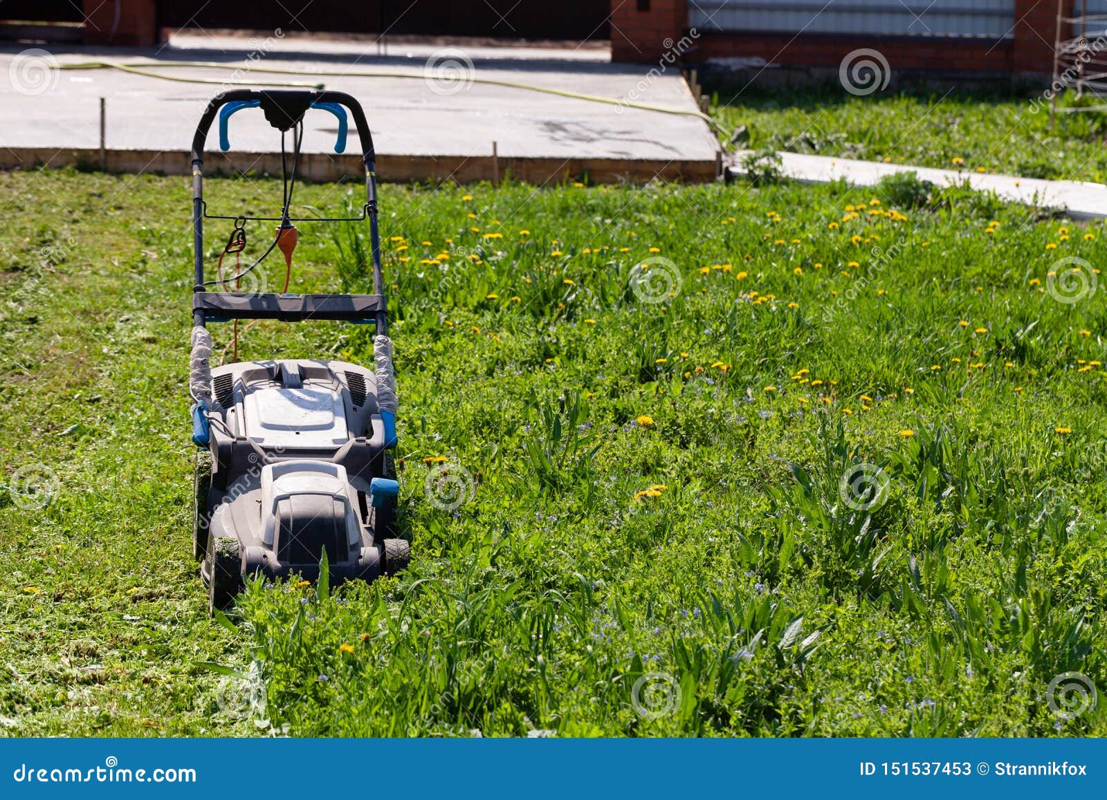 Lawn Mower in the Spring Garden Stock Image - Image of fence, metall ...