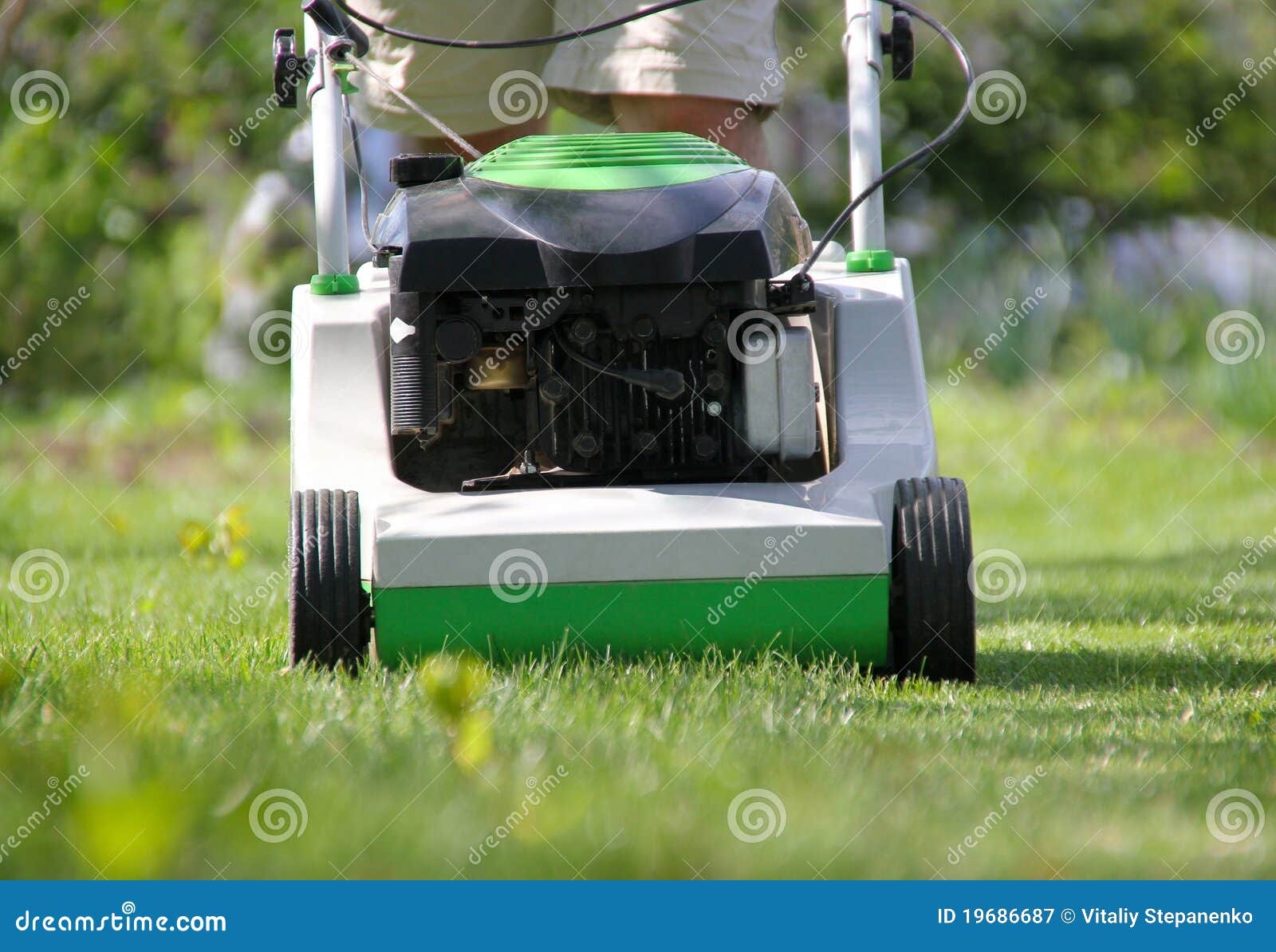 Lawn mower at work stock image. Image of cutting, black - 19686687