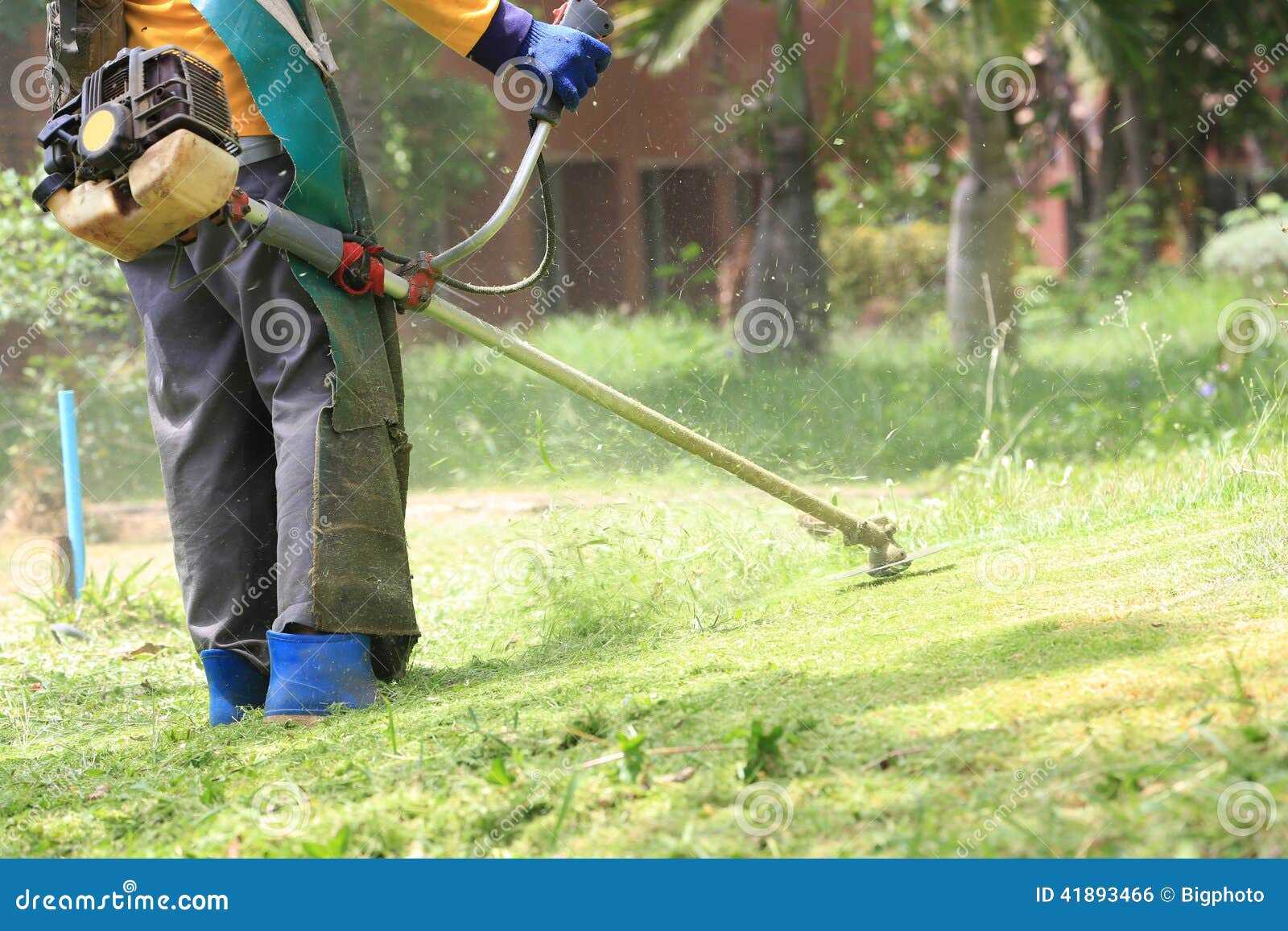 Lawn Mower Worker Cutting Grass in Green Field Stock Photo - Image of ...