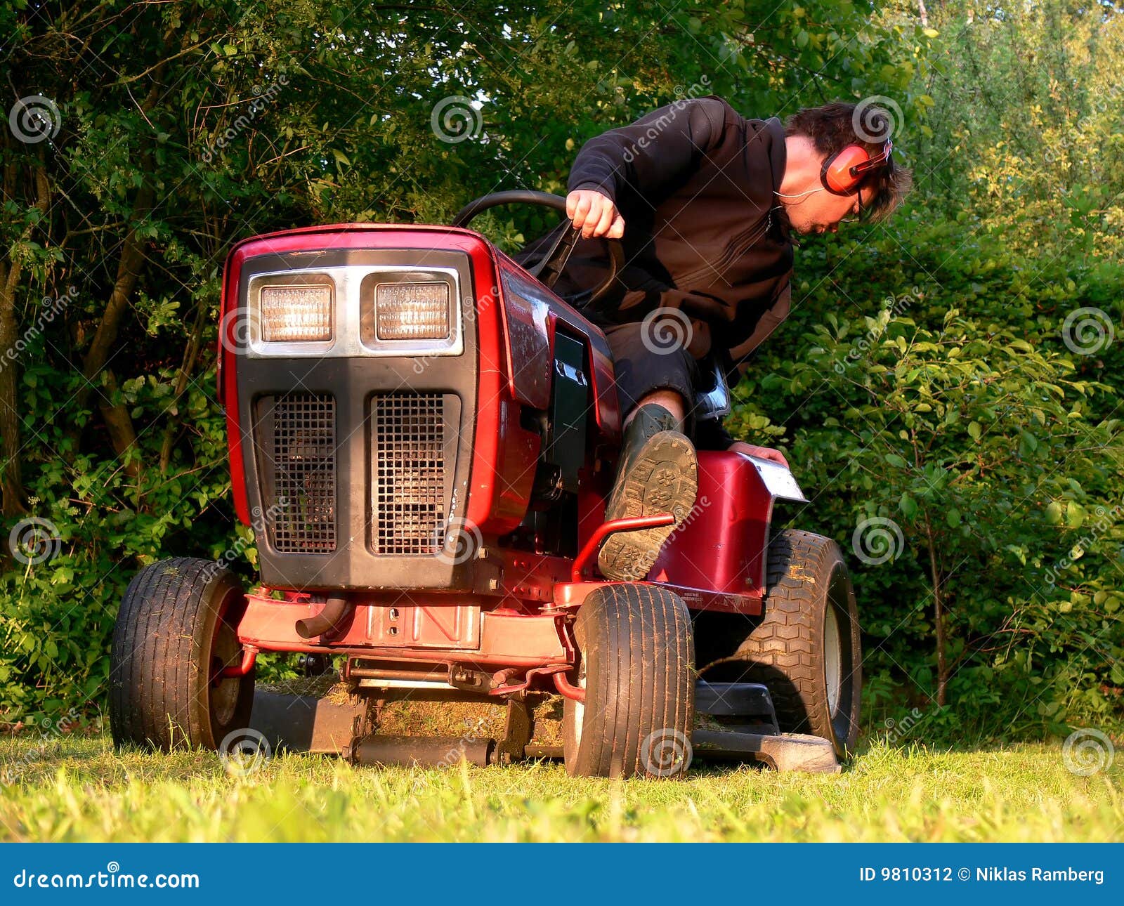 Lawnmover Man - Mowing the Lawn Stock Photo - Image of evening, light ...