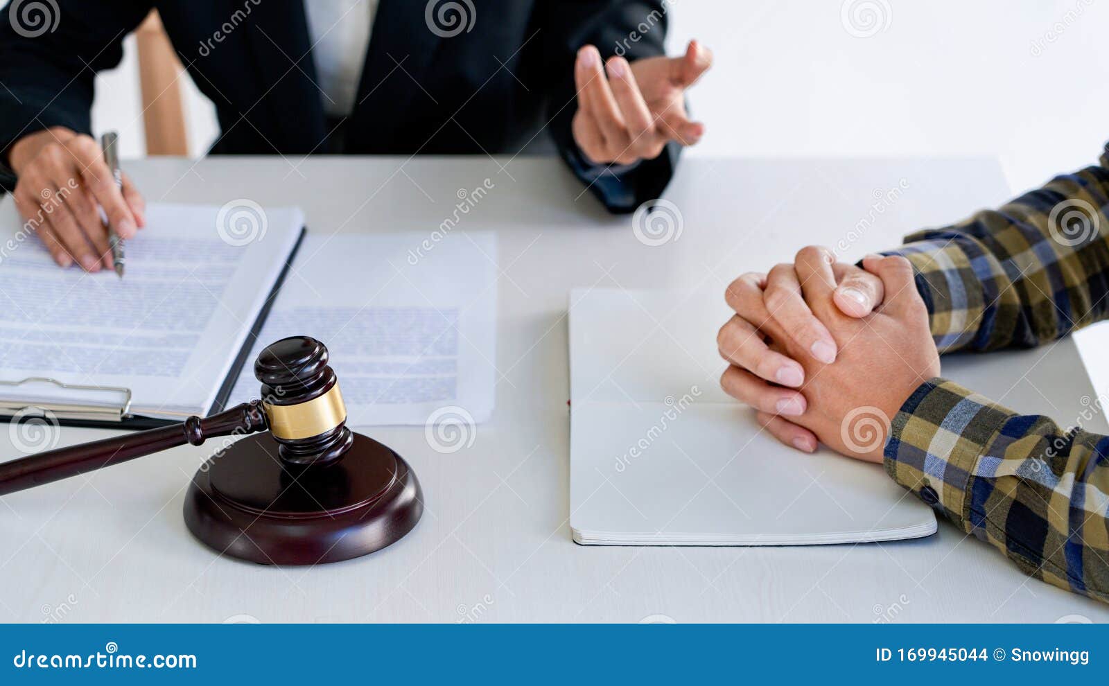 Lawyer Having Meeting and Consoling Solution To His Clients Provide ...