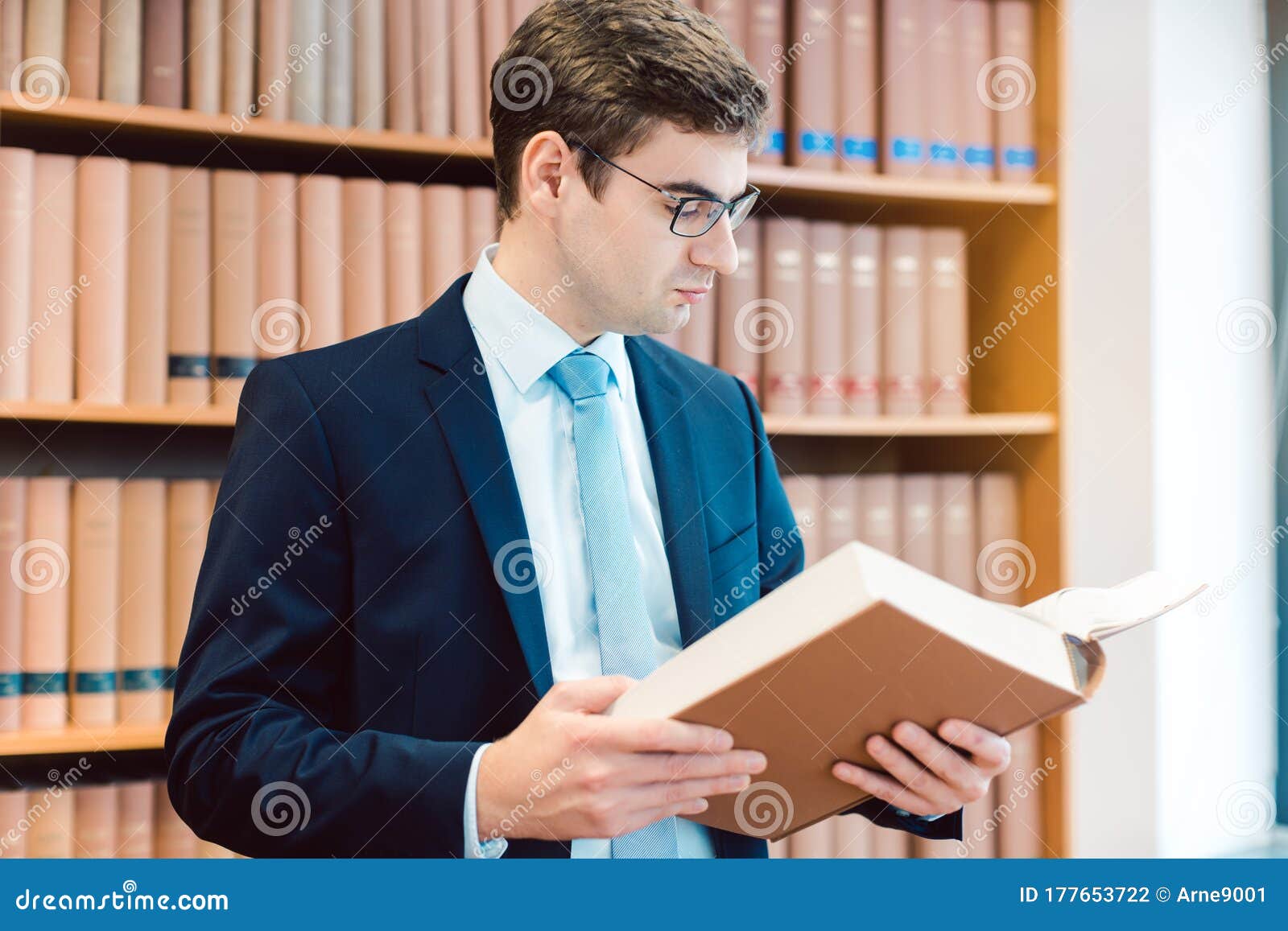 Lawyer in His Office Reading Precedents in Thick Books Stock Photo ...