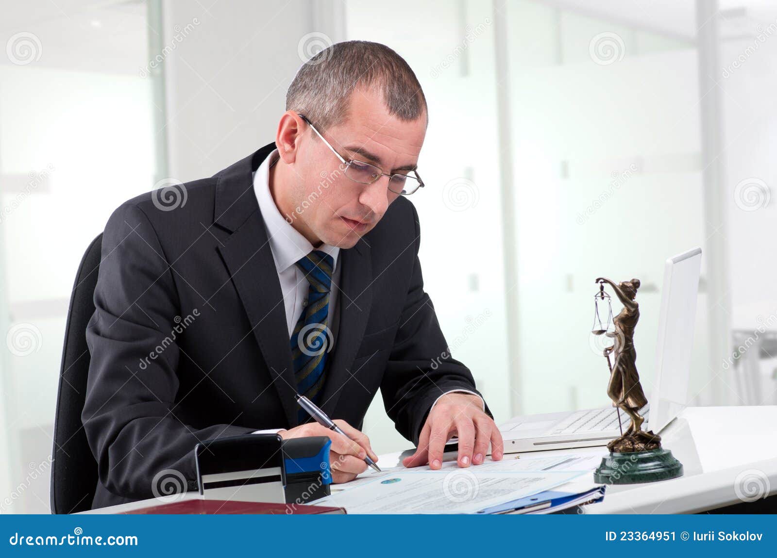 Lawyer on his workplace stock image. Image of contract - 23364951