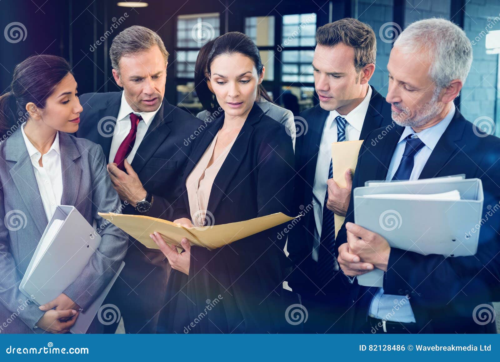 Lawyer Looking at Documents and Interacting with Businesspeople Stock ...