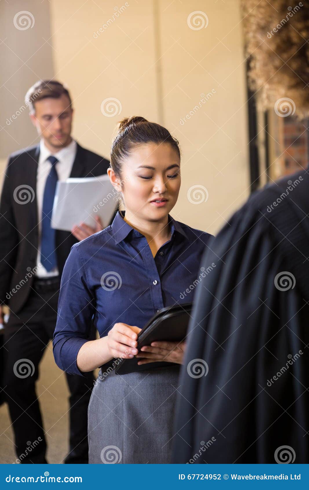 Lawyer Looking at Documents and Interacting with Businesswoman Stock ...